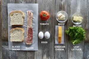 A Classic Dagwood Sandwich with Fried Egg and Cheese